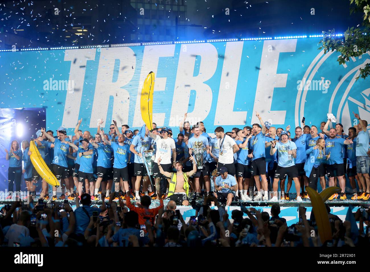 Manchester City players celebrate on stage during the Treble Parade in ...