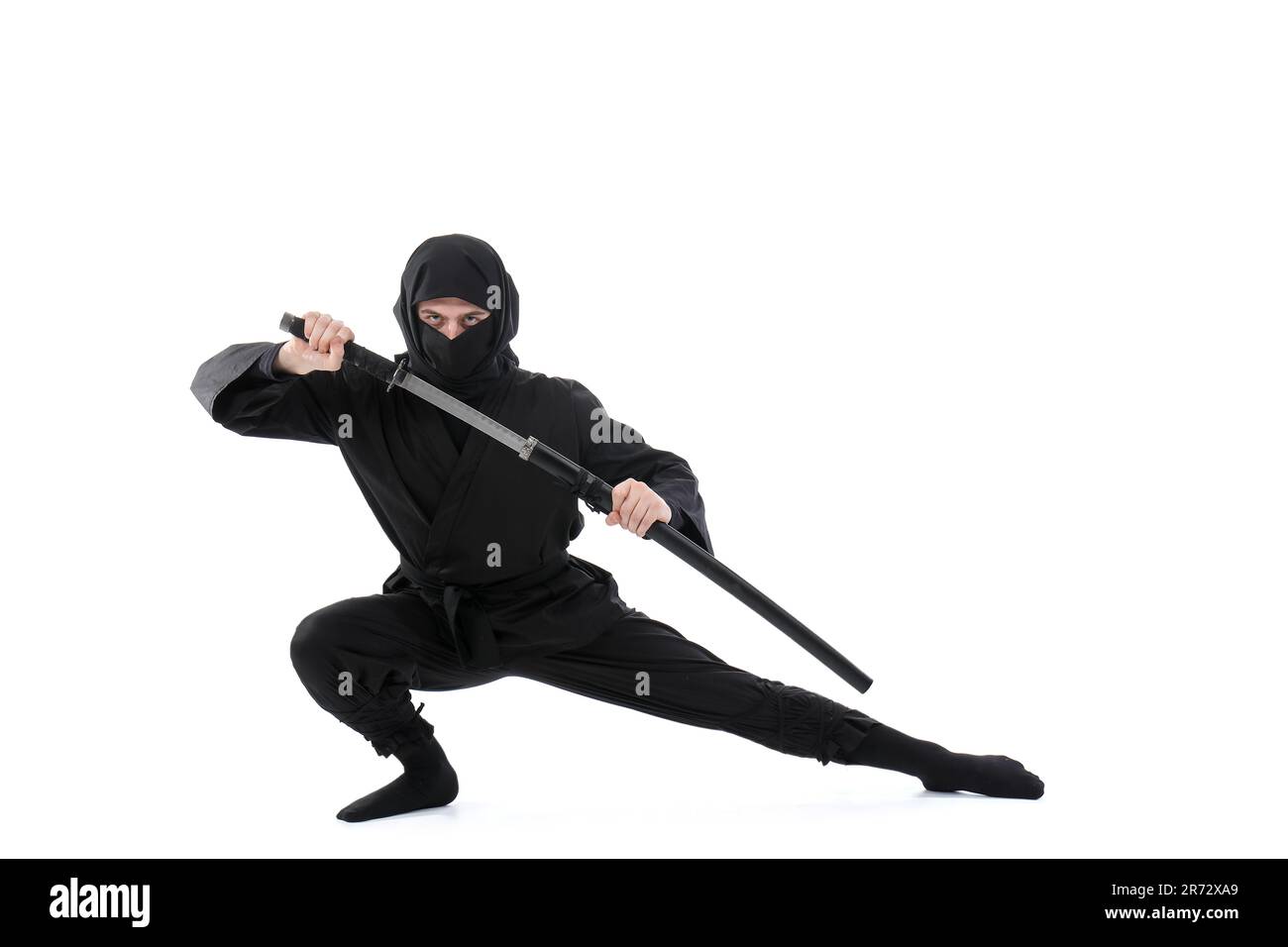 Male ninja with sword on white background Stock Photo - Alamy