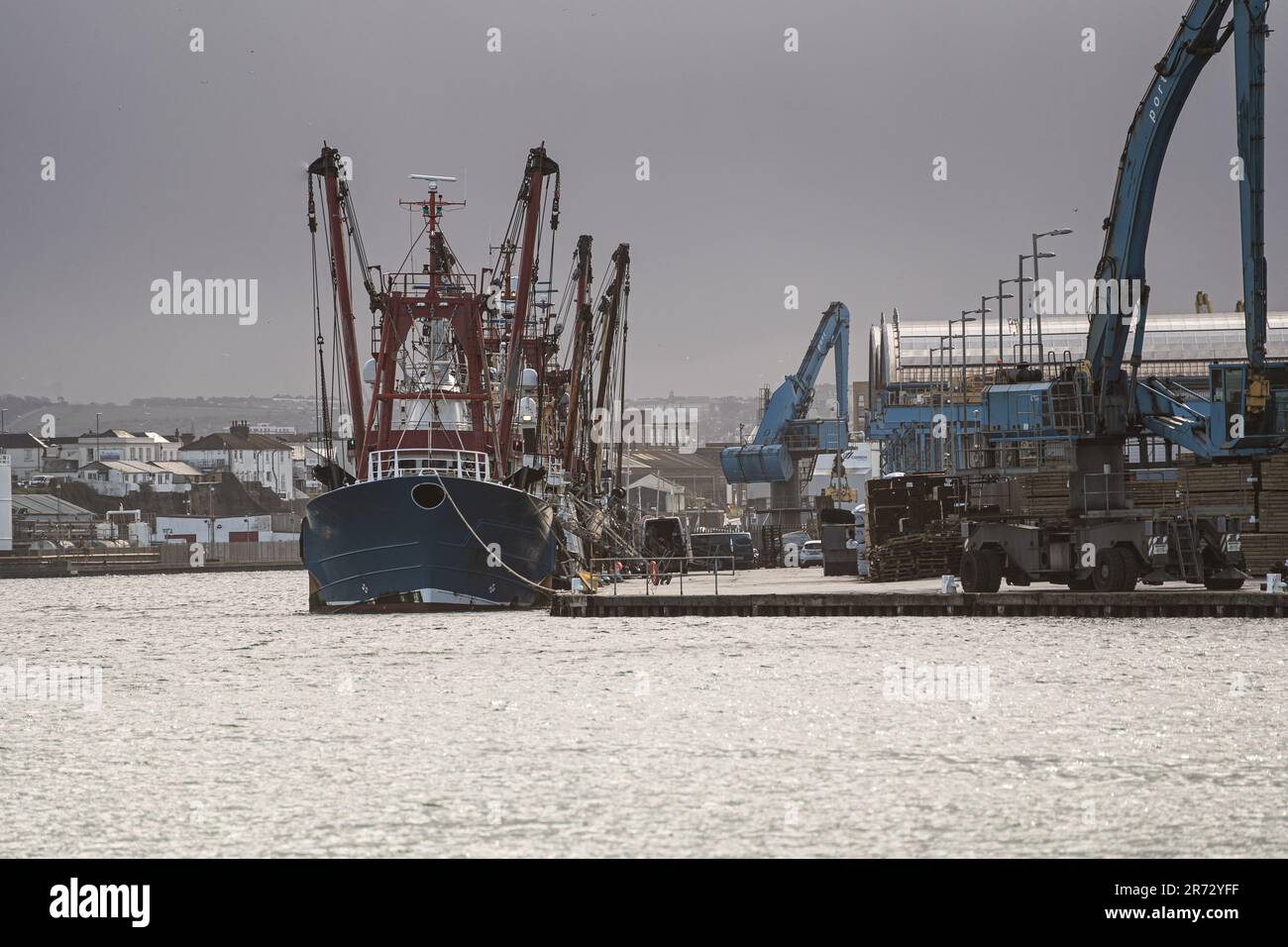 Ships in port unloading Stock Photo - Alamy