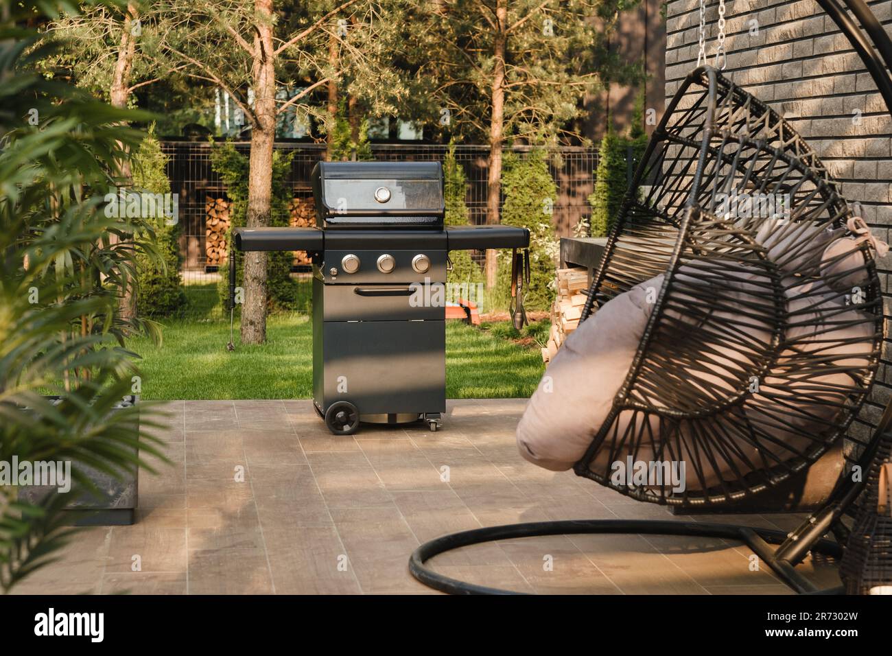 A large barbecue grill stands in the courtyard on the terrace street ...