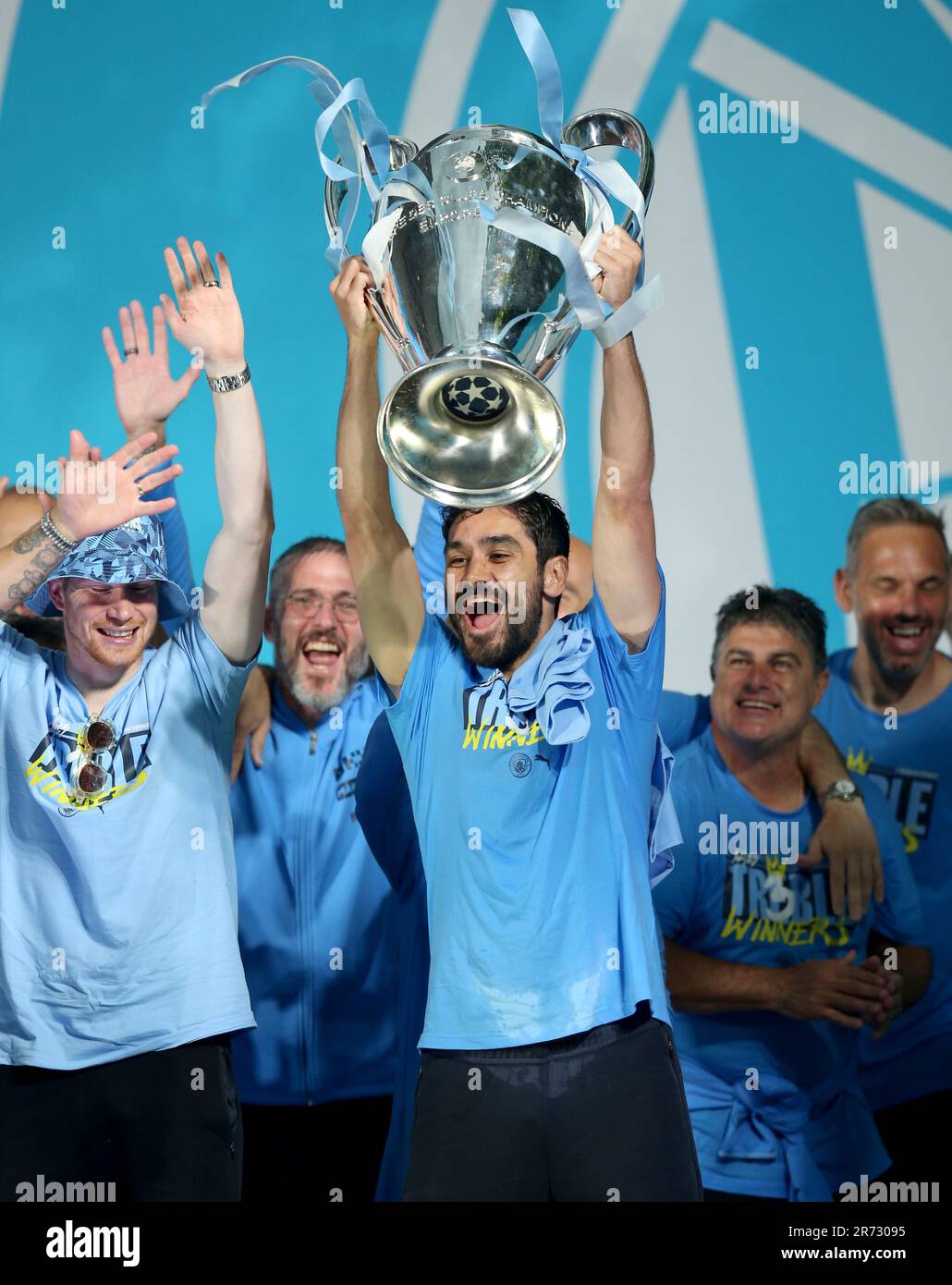 Manchester City's Ilkay Gundogan celebrates on stage with the Champions ...