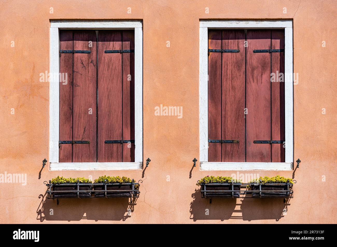 Close up detail with old medieval architecture venetian window. Closed ...