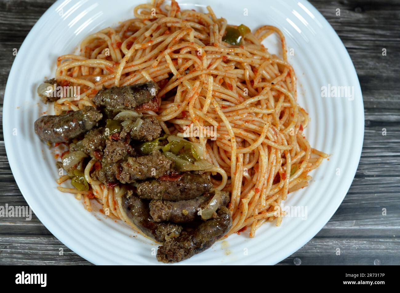 A plate of Middle Eastern cooked beef sausage, Egyptian sausages with ...