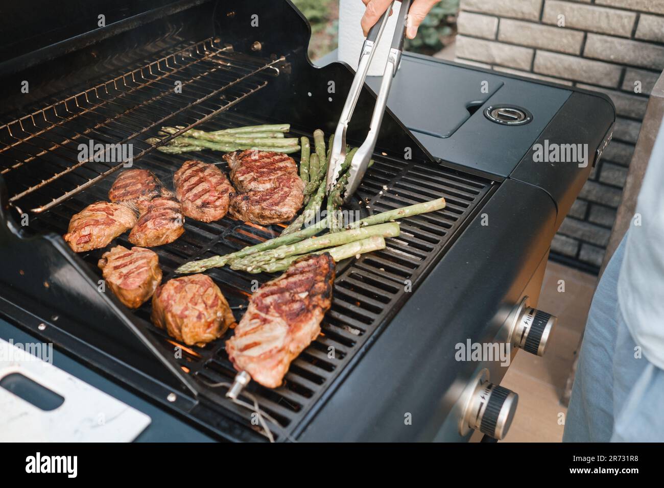 Cooking meat and vegetables on an outdoor grill Stock Photo - Alamy