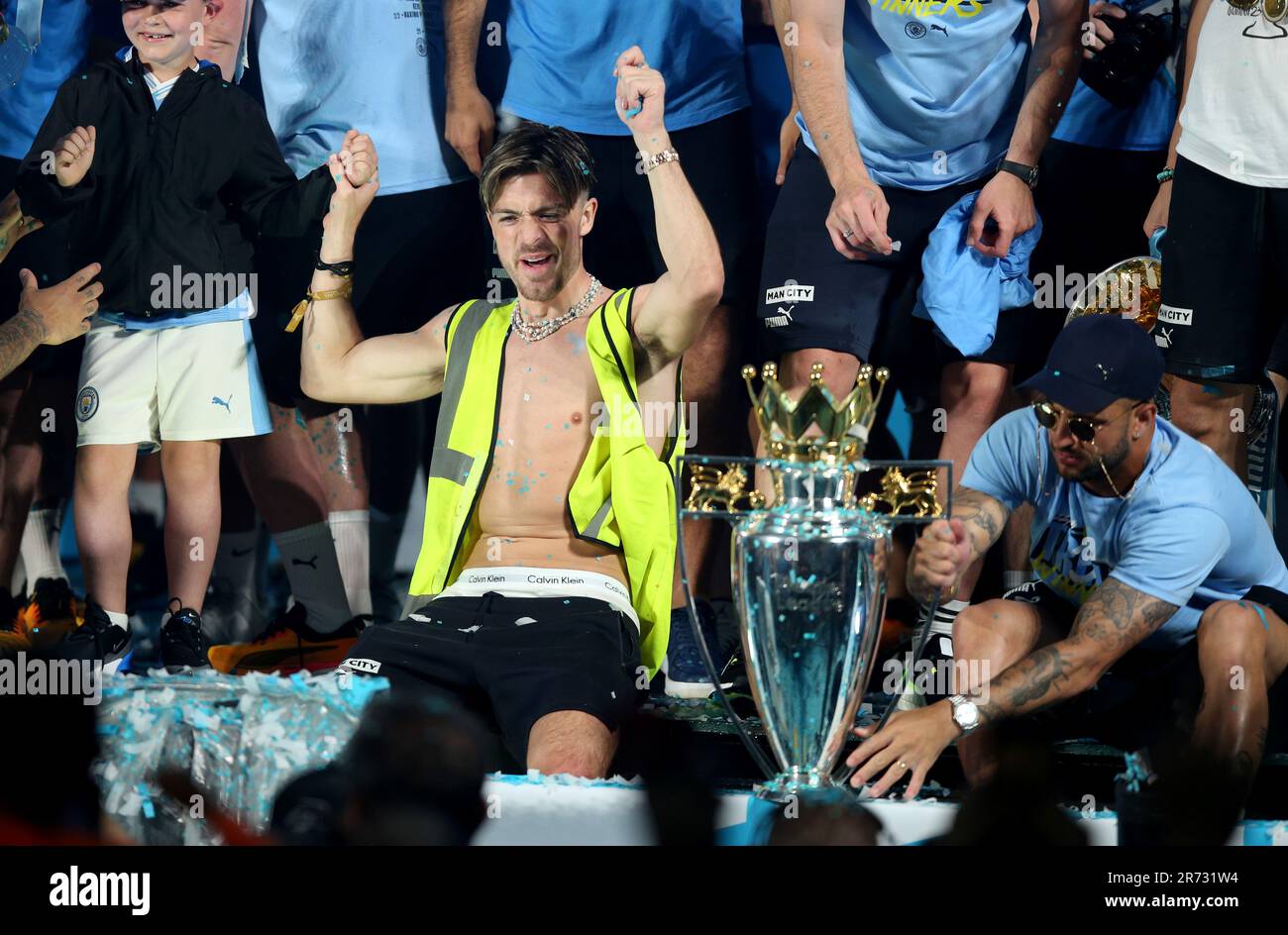 Manchester City's Jack Grealish celebrates on stage with their trophies ...