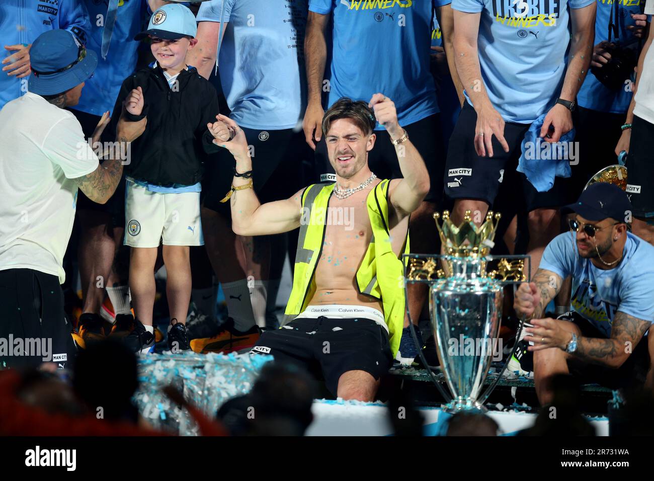 Manchester City's Jack Grealish celebrates on stage with their trophies ...