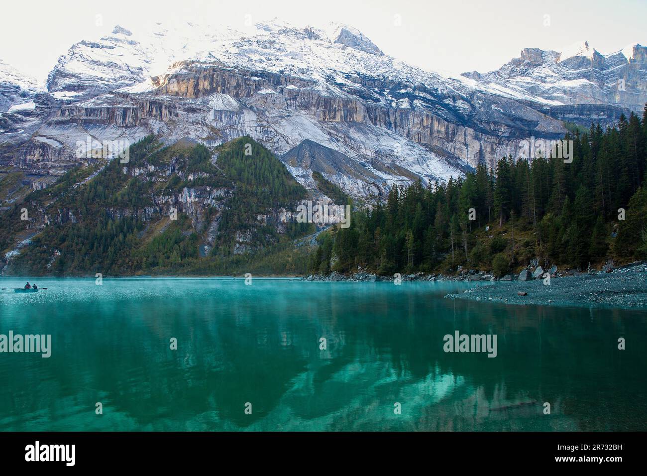 A stunning view of Lake Oeschinensee and the majestic Alps in ...