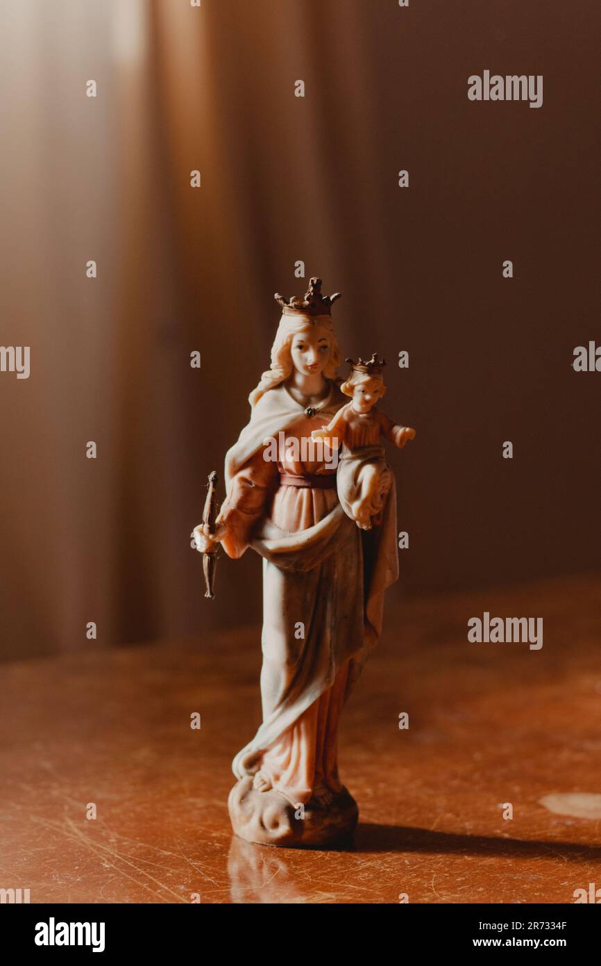 catholic statue of lady helper Stock Photo - Alamy