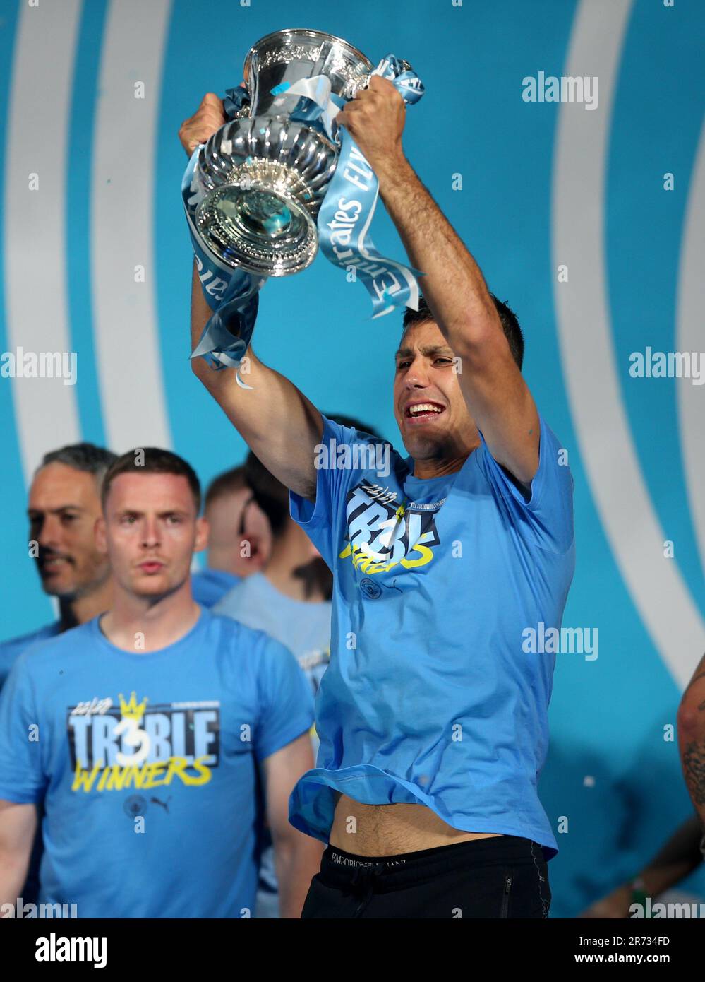 Manchester City's Rodri celebrates on stage with the FA Cup trophy ...
