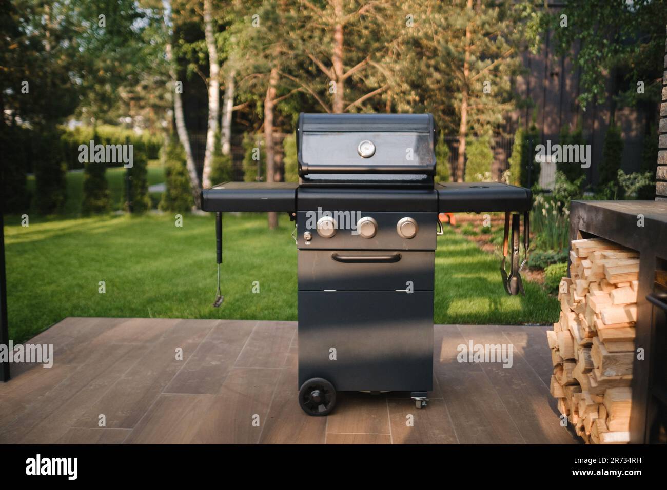 A large barbecue grill stands in the courtyard on the terrace street ...