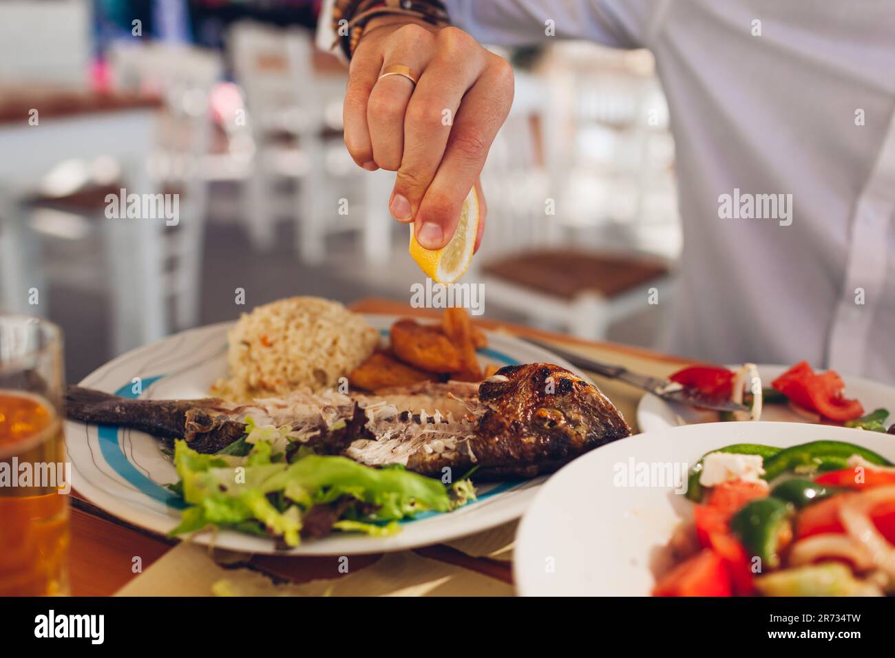 Squeezing lemon on outdoor table hi-res stock photography and images ...