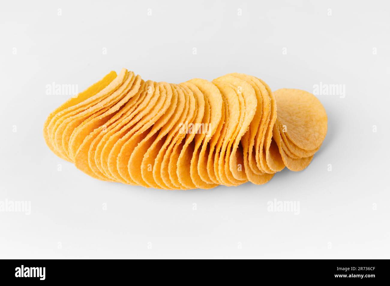 Potato chips of a beautiful identical shape on a white background close ...