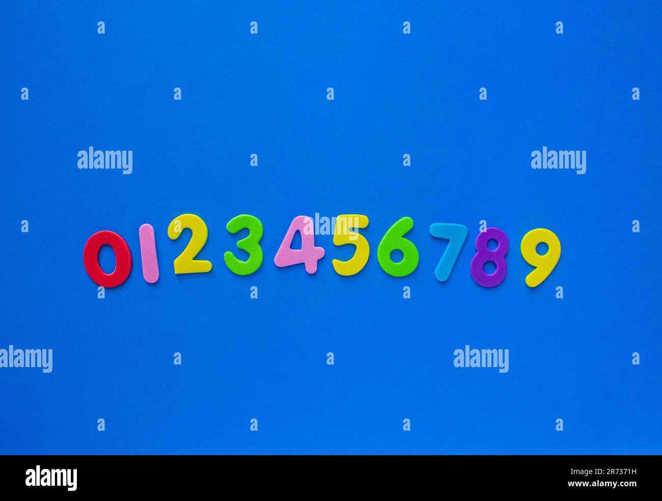 Colorful bright numbers from 0 to 9 on Blue background with copy space ...