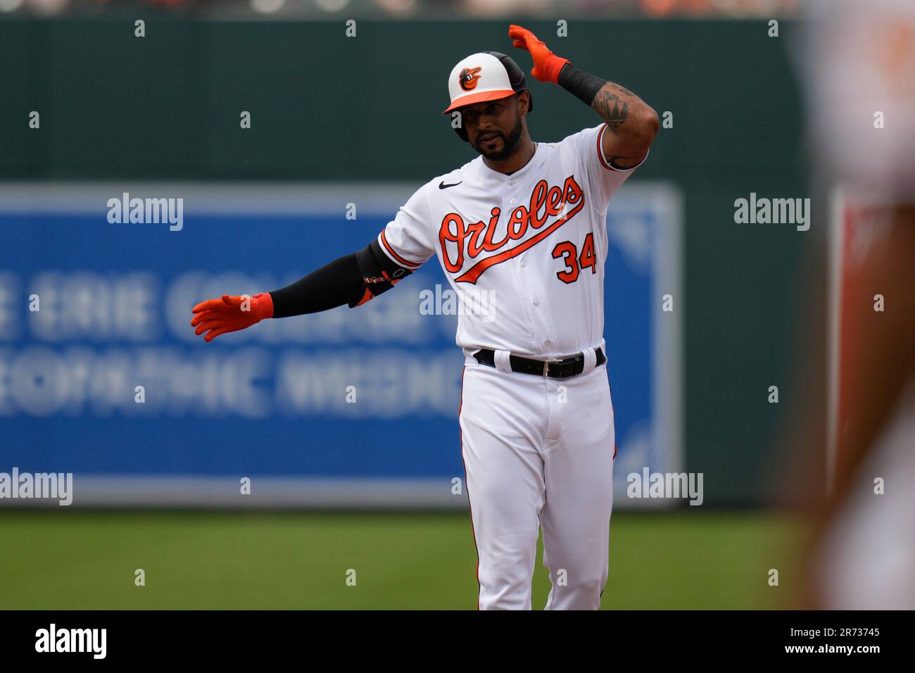 Baltimore Orioles center fielder Aaron Hicks gestures after he hits a ...