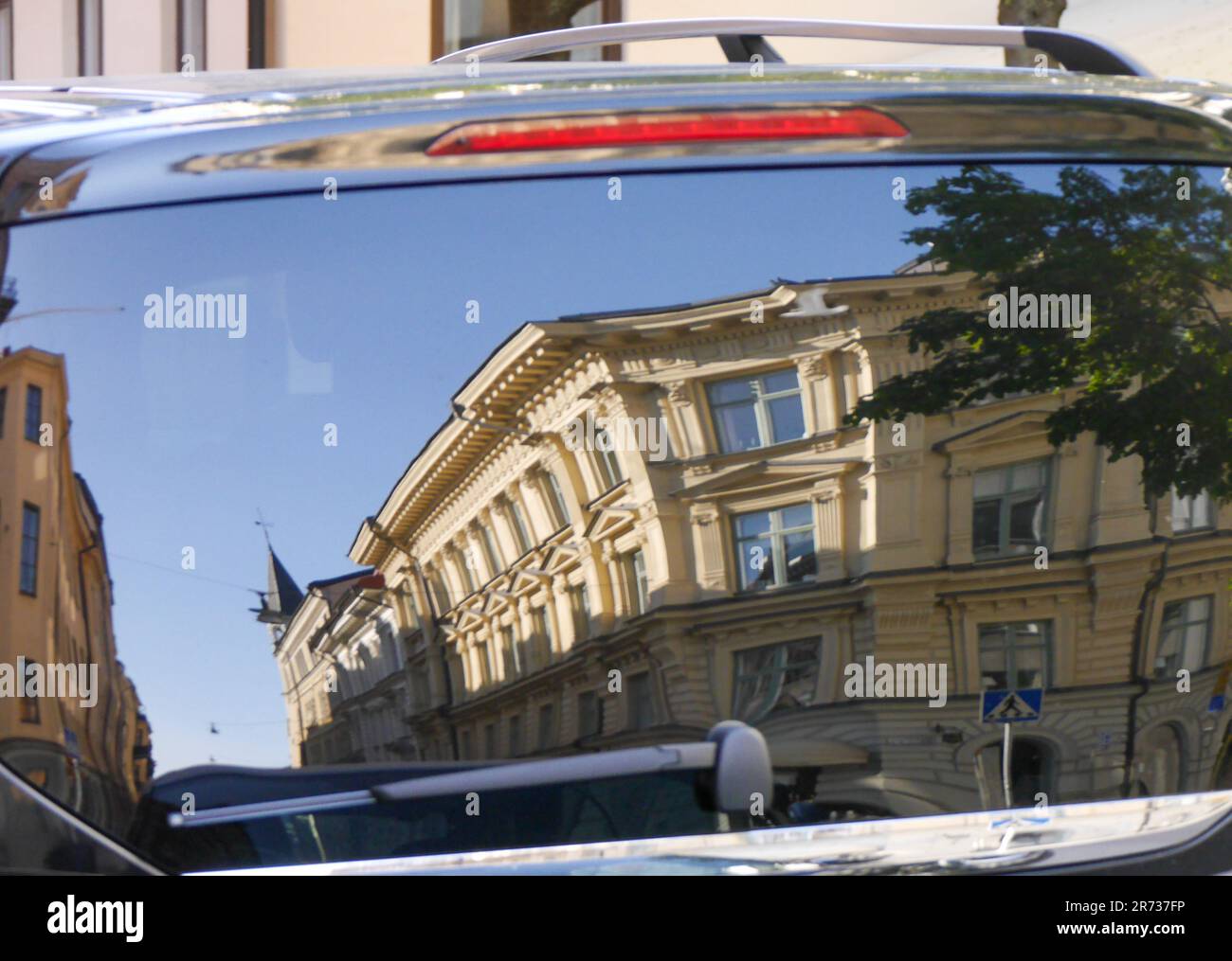 a car parked on the side of a building Stock Photo - Alamy