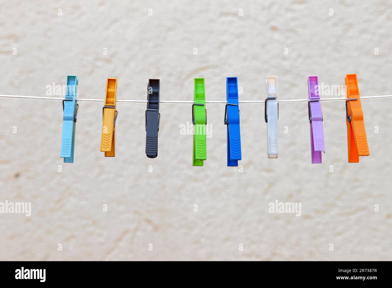 Colorful Clothespins On The Clothesline Stock Photo - Alamy