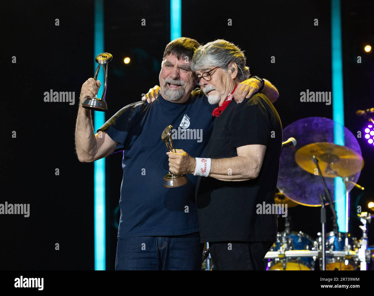 Teddy Gentry and Randy Owen of Alabama receive the CMA Pinnacle Award ...