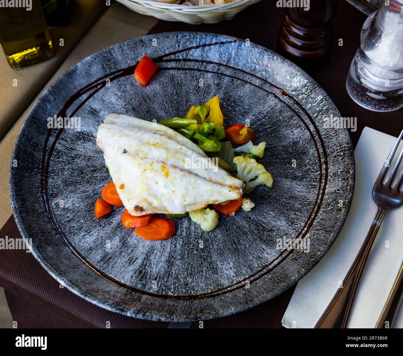 Baked dorado fish fillet with broccoli, carrot and pepper Stock Photo ...