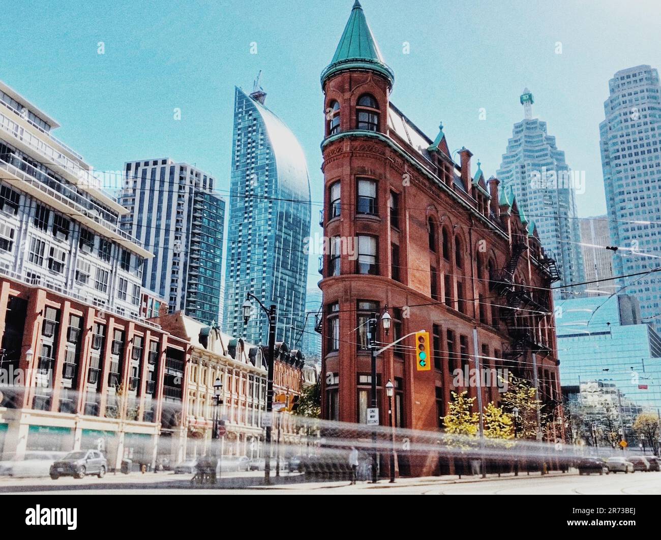 A traditional building situated between other structures in a cityscape ...