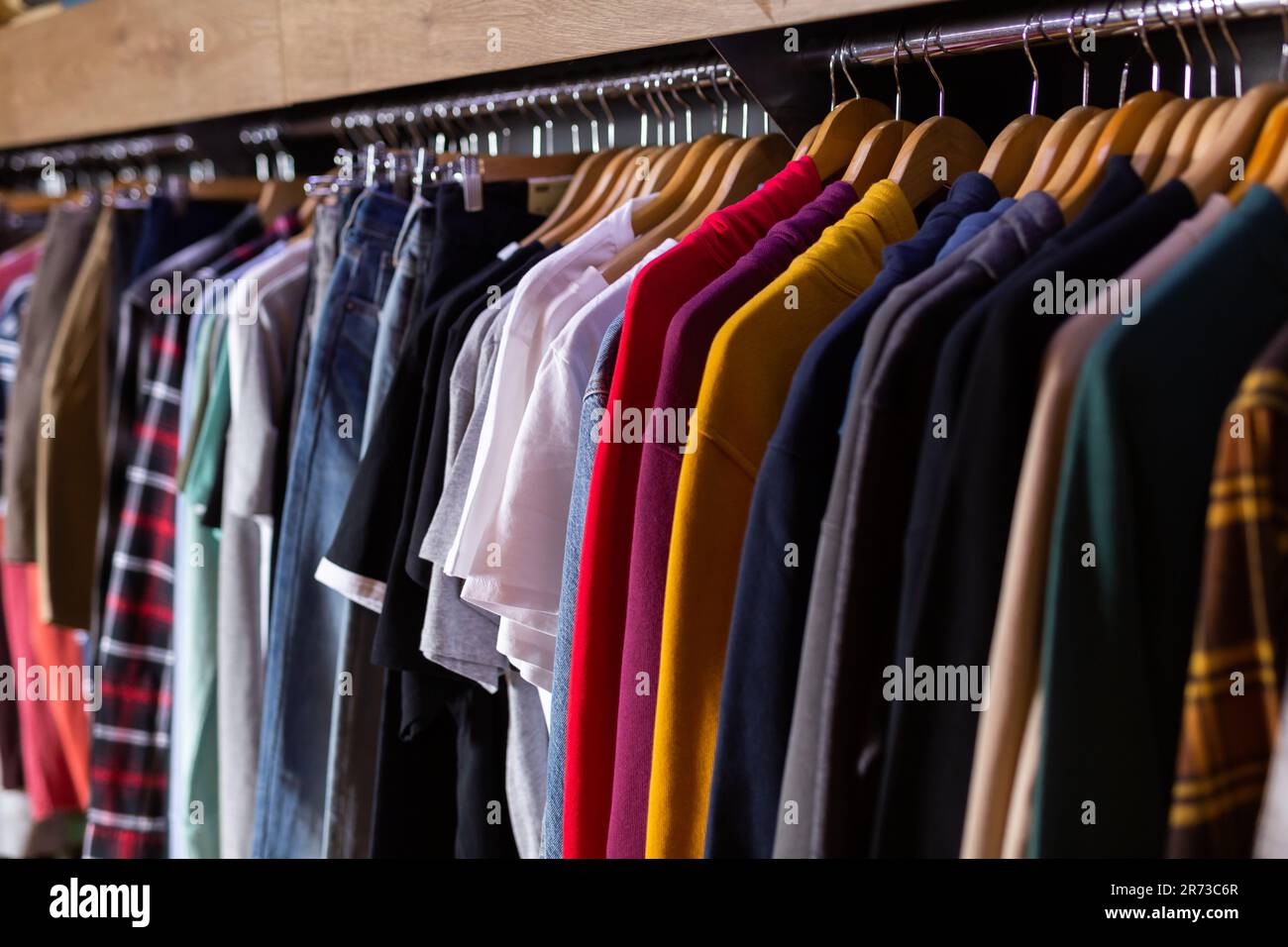 Stand with various clothes in clothing boutique Stock Photo - Alamy