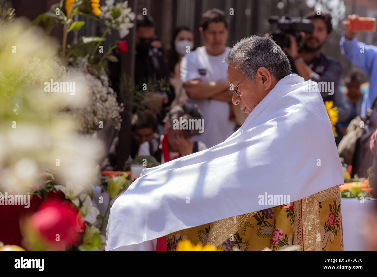 Priests and members of the Catholic church perform a procession in ...