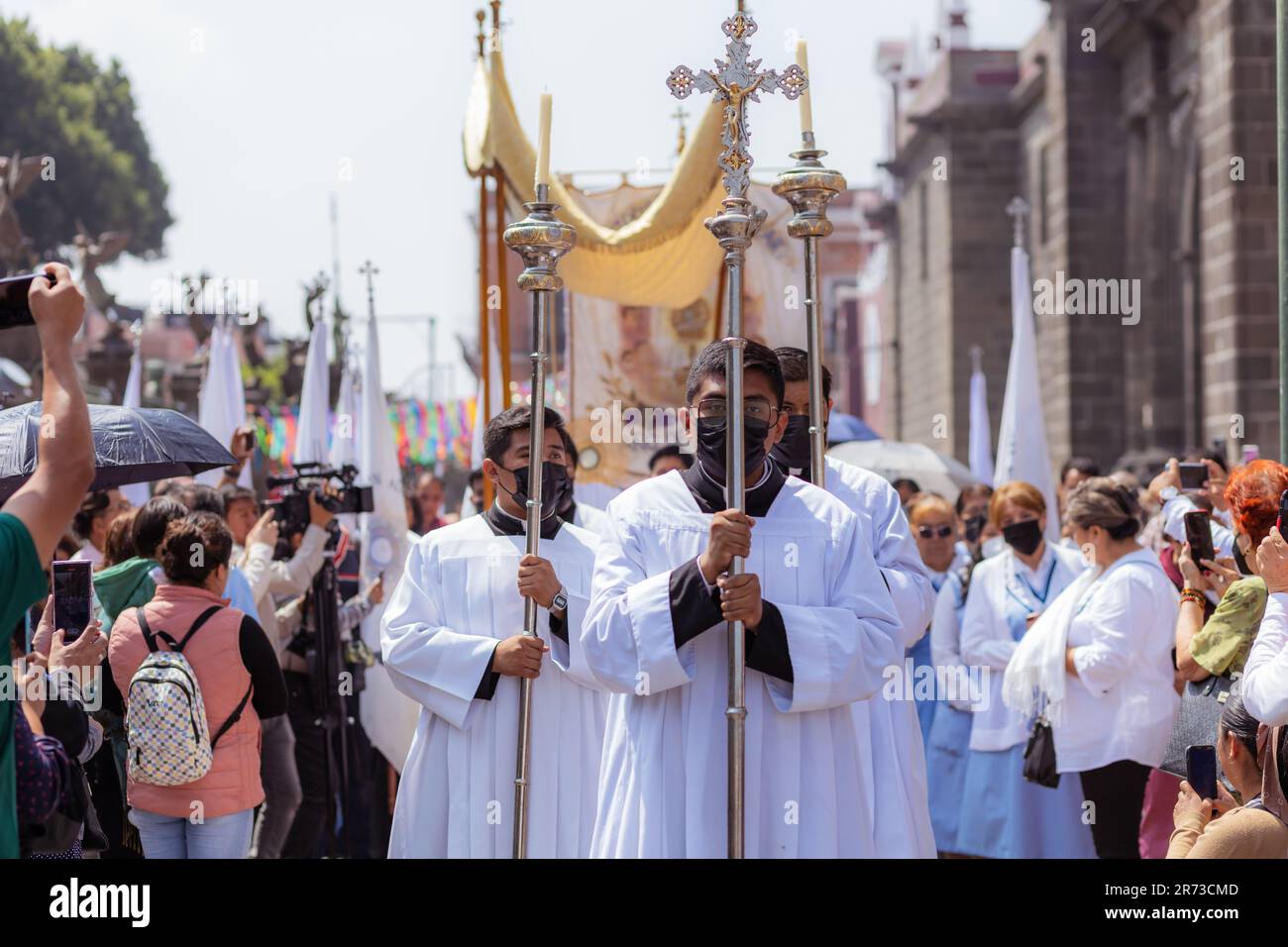 Priests and members of the Catholic church perform a procession in ...