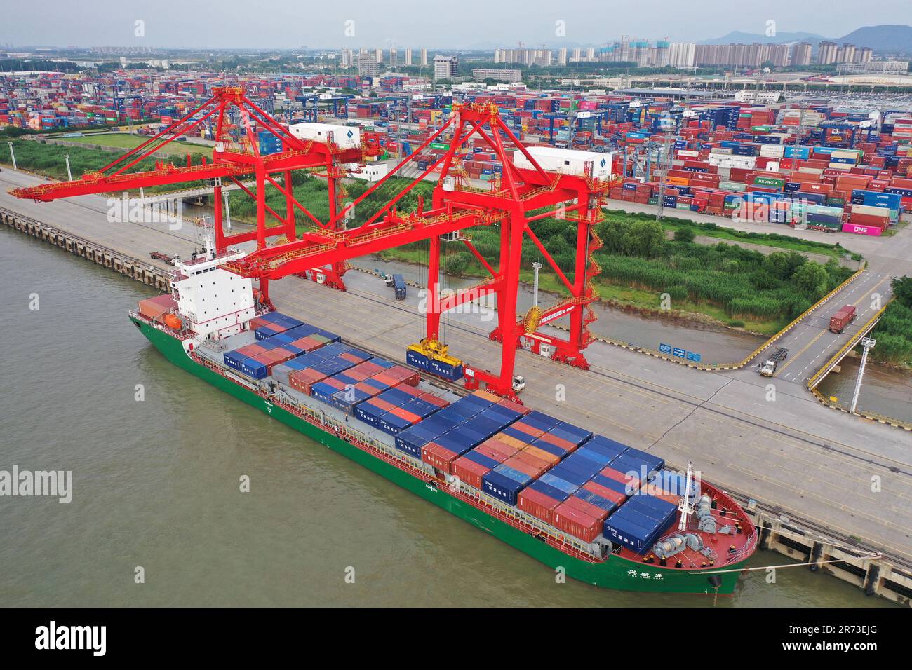 NANJING, CHINA - JUNE 12, 2023 - Cargo ships dock at the container ...