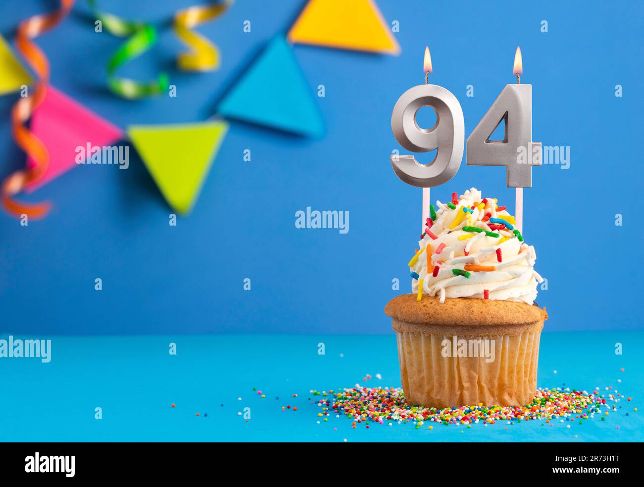 Candle number 94 - Cake birthday in blue background Stock Photo - Alamy
