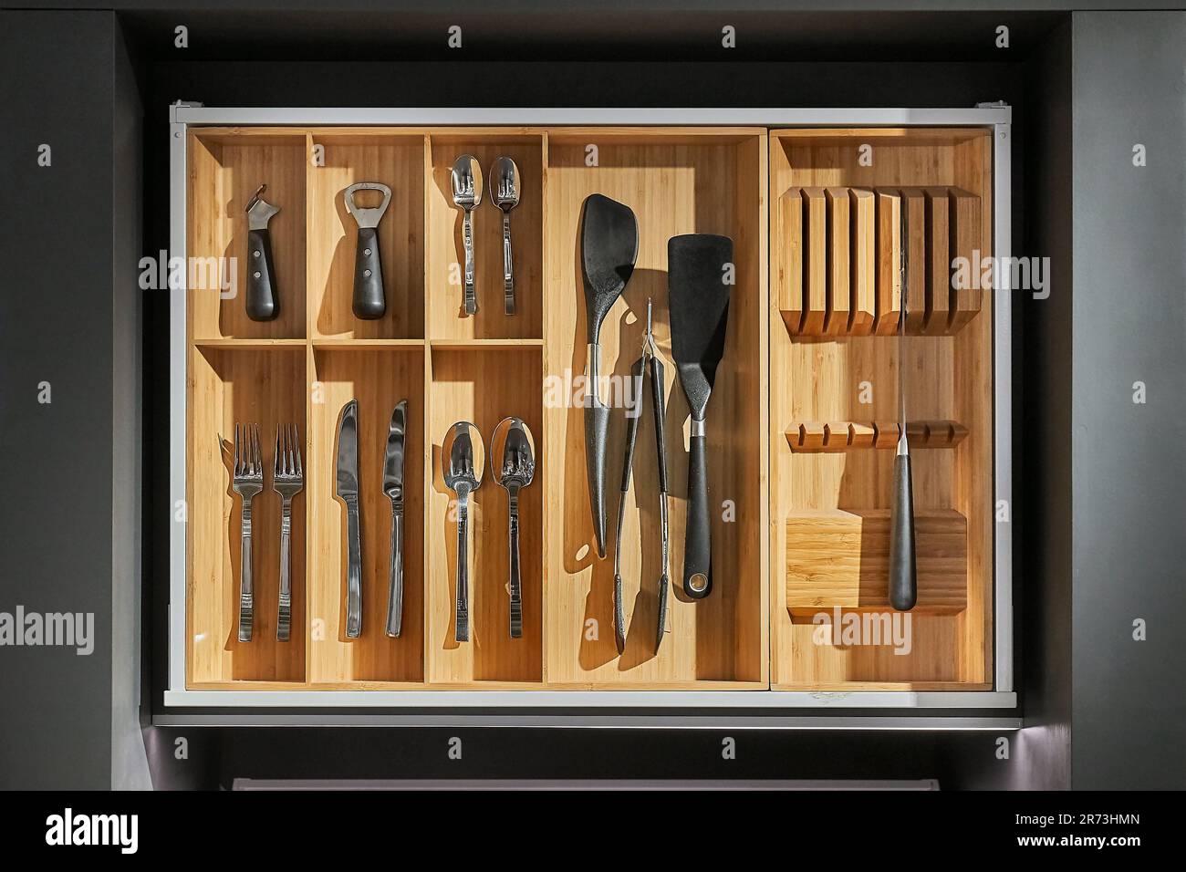 Minimalist kitchen tools put away in a drawer Stock Photo - Alamy