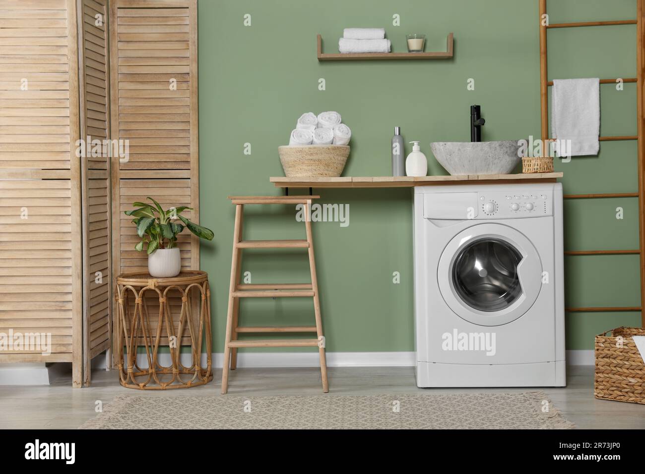 Stylish laundry room with functional washing machine. Interior design ...