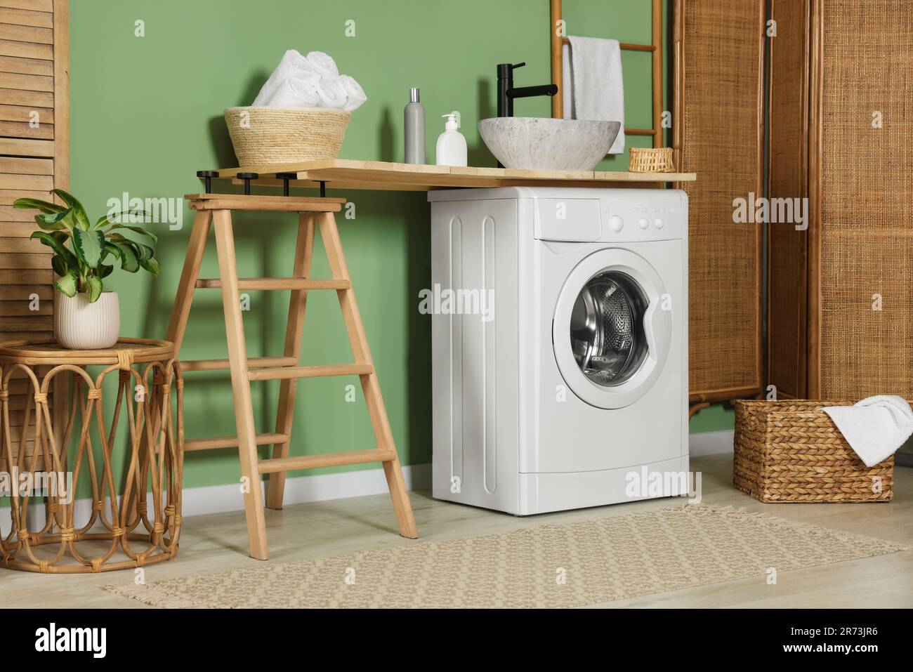 Stylish laundry room with functional washing machine. Interior design ...