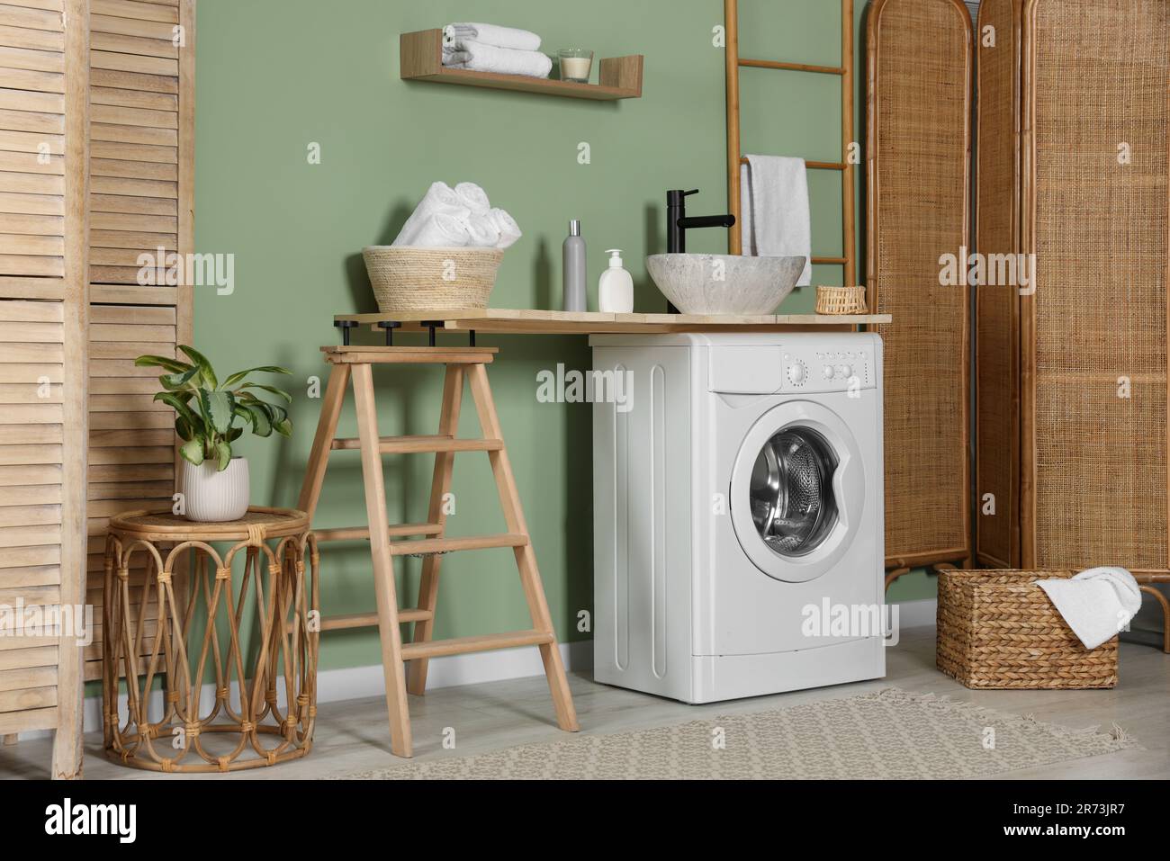 Stylish laundry room with functional washing machine. Interior design ...