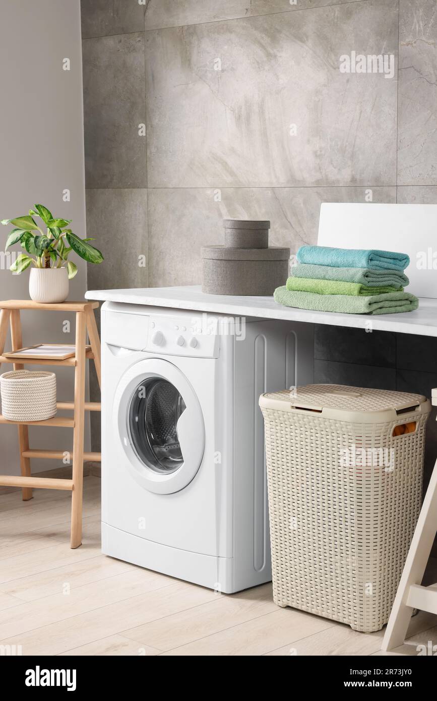 Stylish laundry room with modern washing machine. Interior design Stock ...