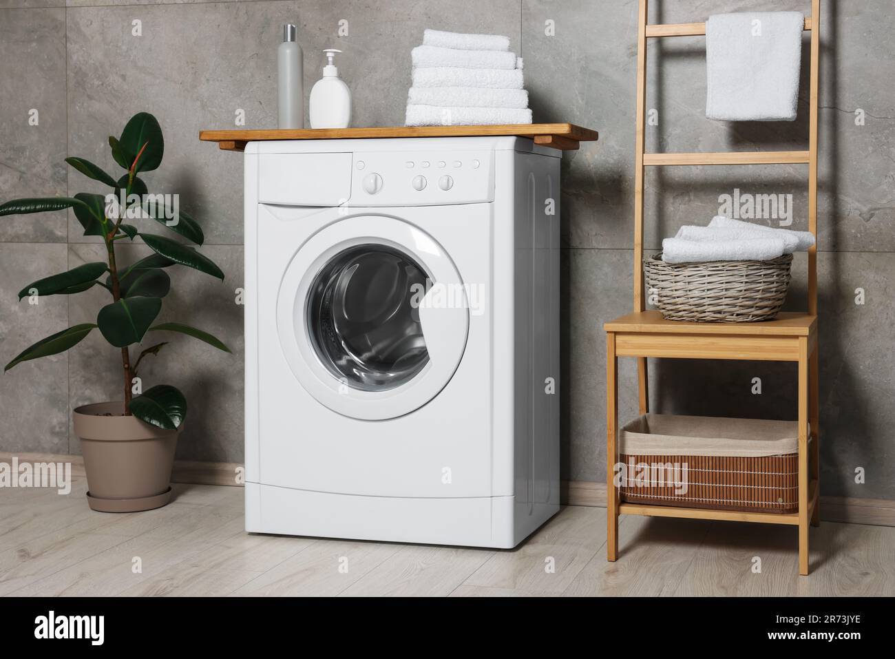 Stylish laundry room with modern washing machine. Interior design Stock ...