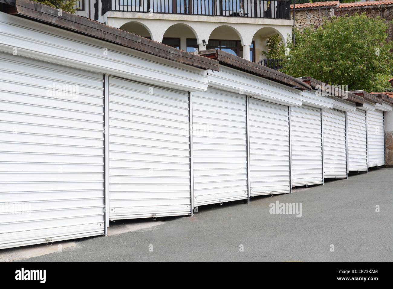 Stalls closed with roller shutters in city Stock Photo - Alamy