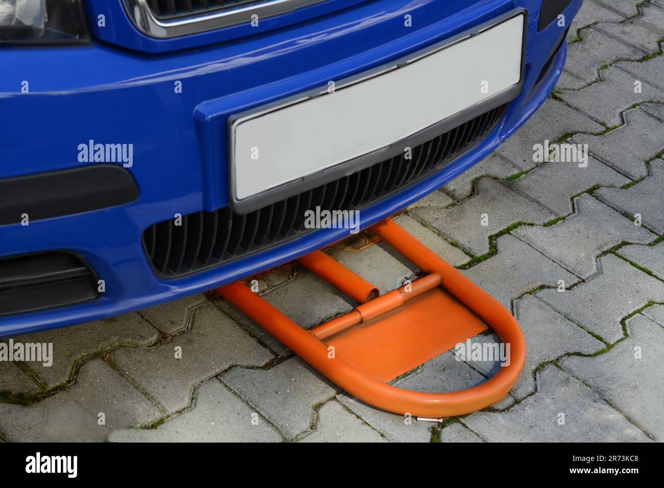 Parking barrier under car on pavement outdoors, closeup Stock Photo - Alamy