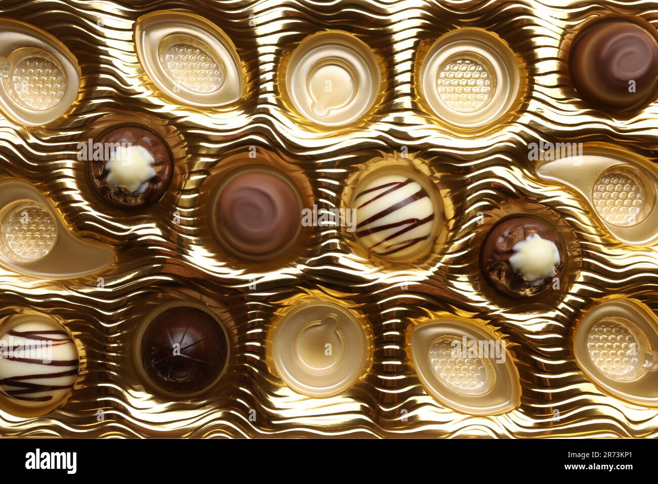 Partially empty box of chocolate candies as background, top view Stock ...