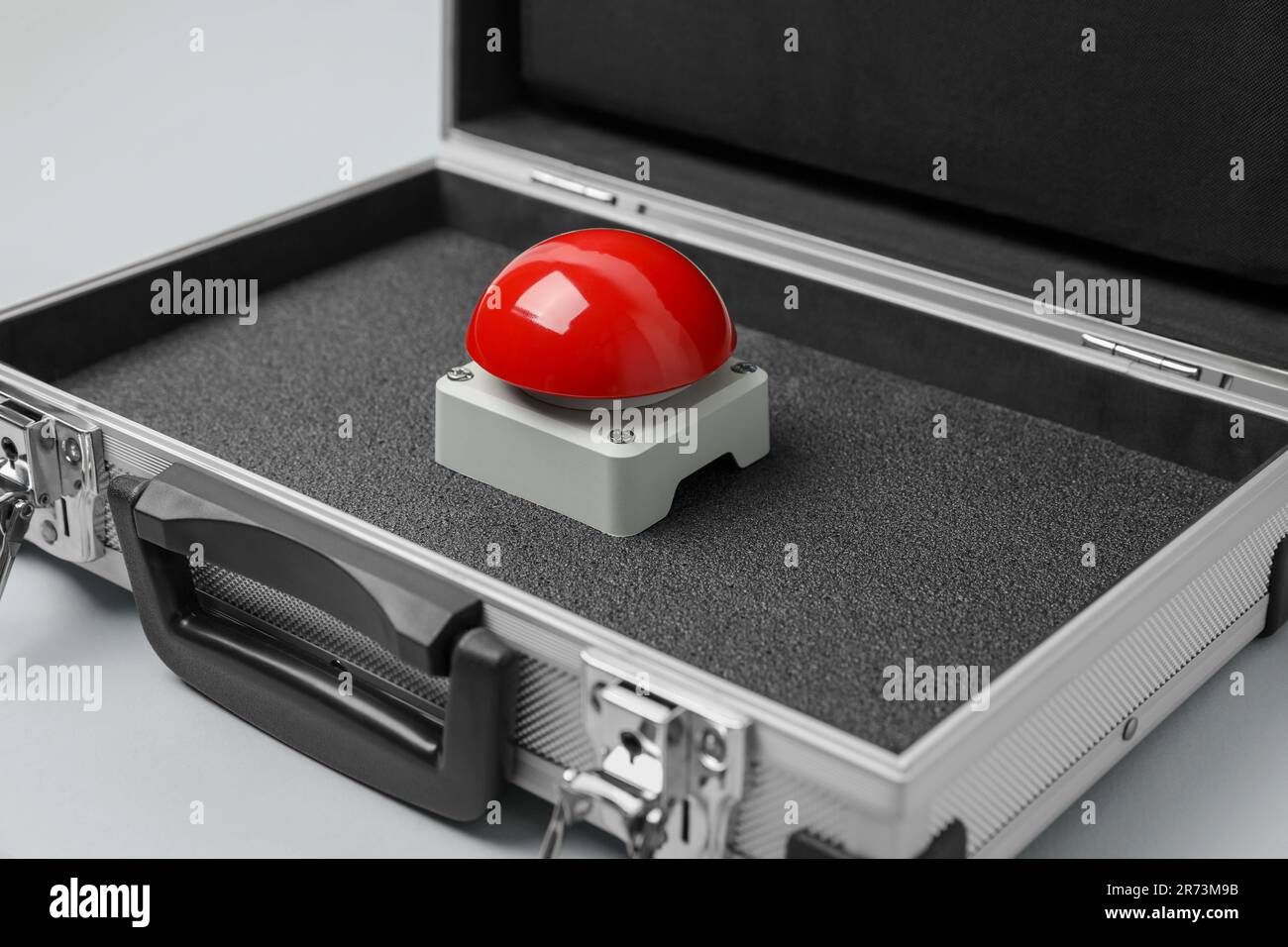 Red button of nuclear weapon in suitcase on white background. War ...