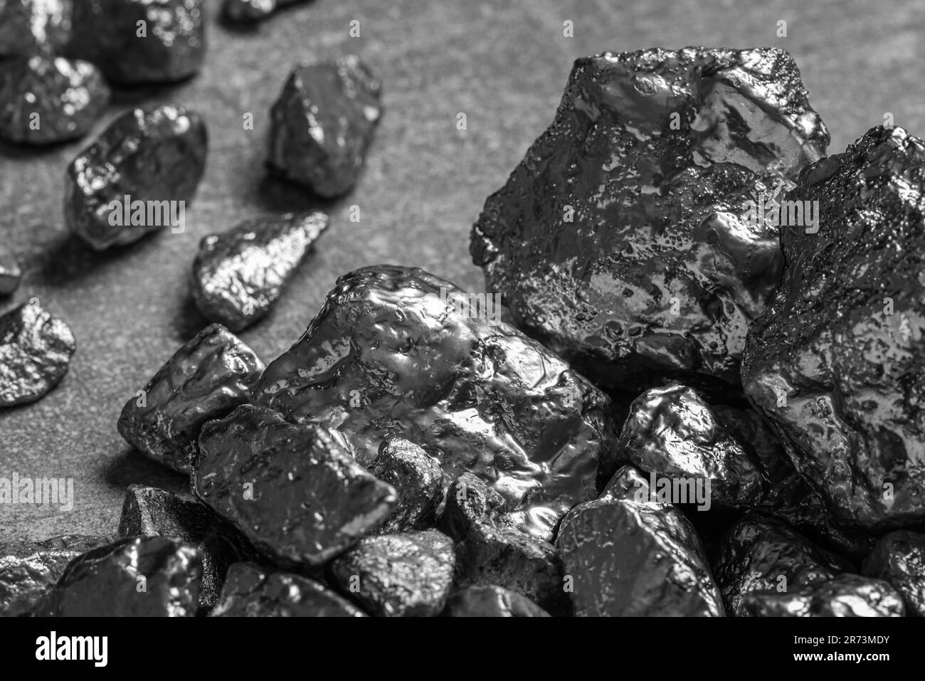 Pile of silver nuggets on light grey table, closeup Stock Photo - Alamy
