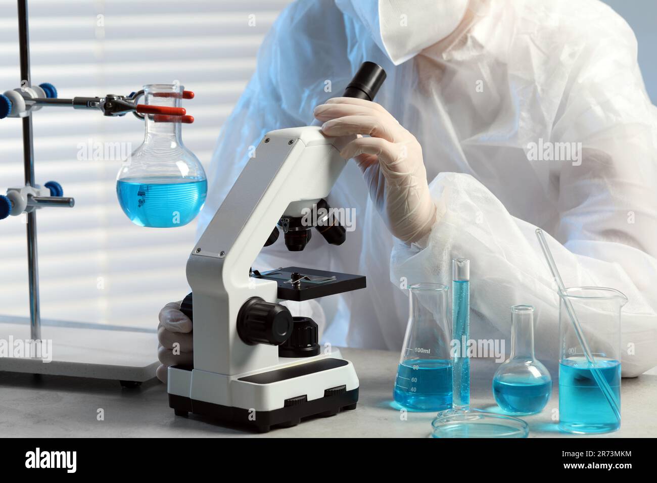 Scientist working with microscope in laboratory, closeup Stock Photo ...