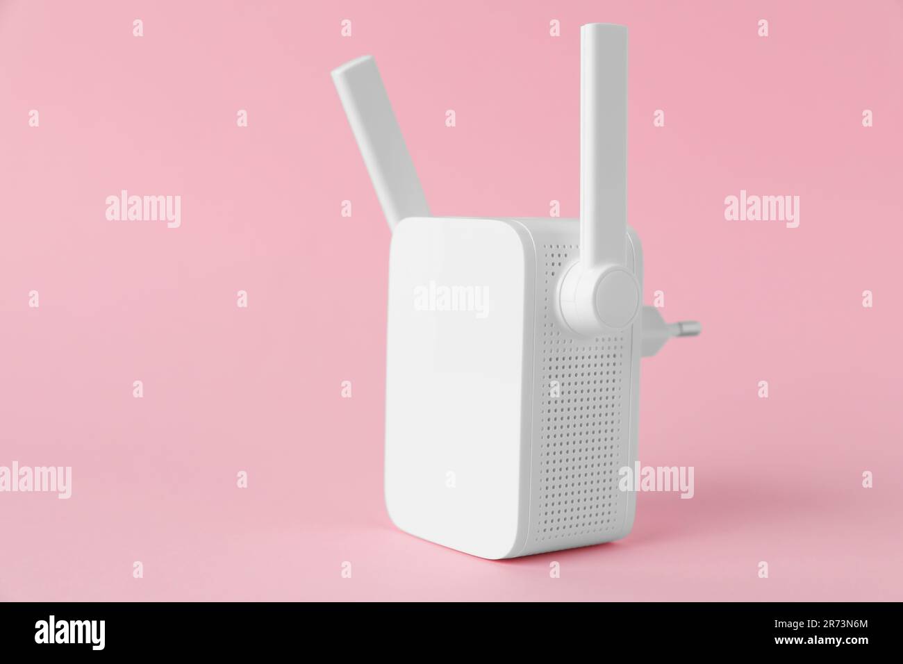 New modern Wi-Fi repeater on pink background, space for text Stock ...