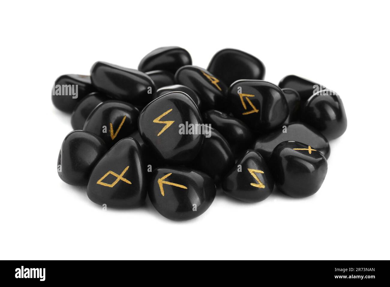 Pile of black rune stones isolated on white Stock Photo - Alamy