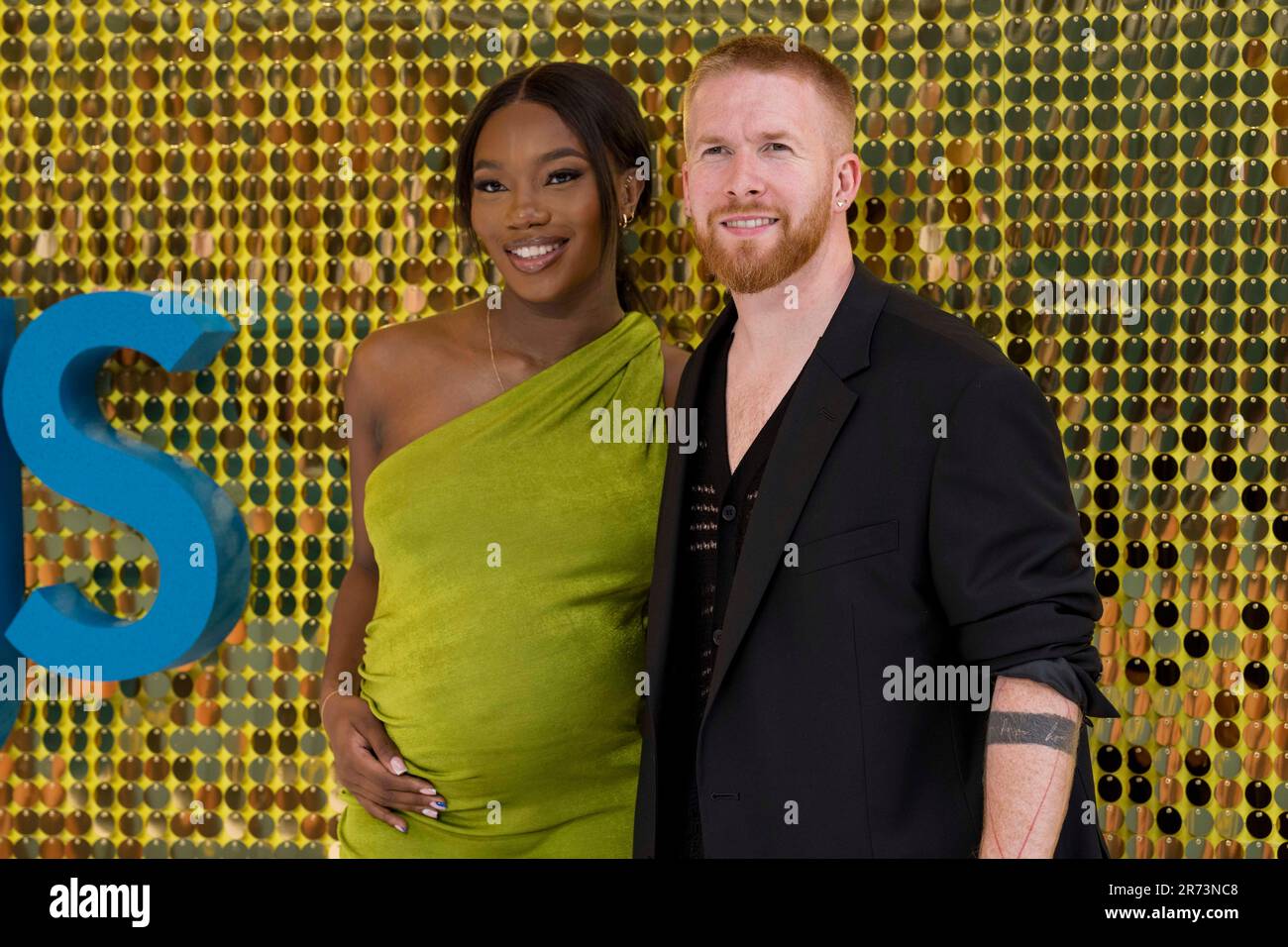 Chyna Mills, left, and Neil Jones pose for photographers upon arrival ...