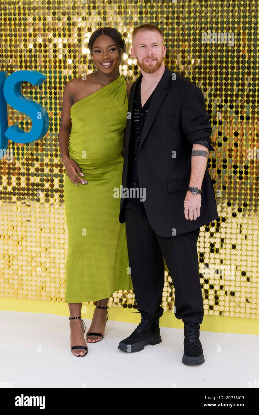 Chyna Mills, left, and Neil Jones pose for photographers upon arrival ...