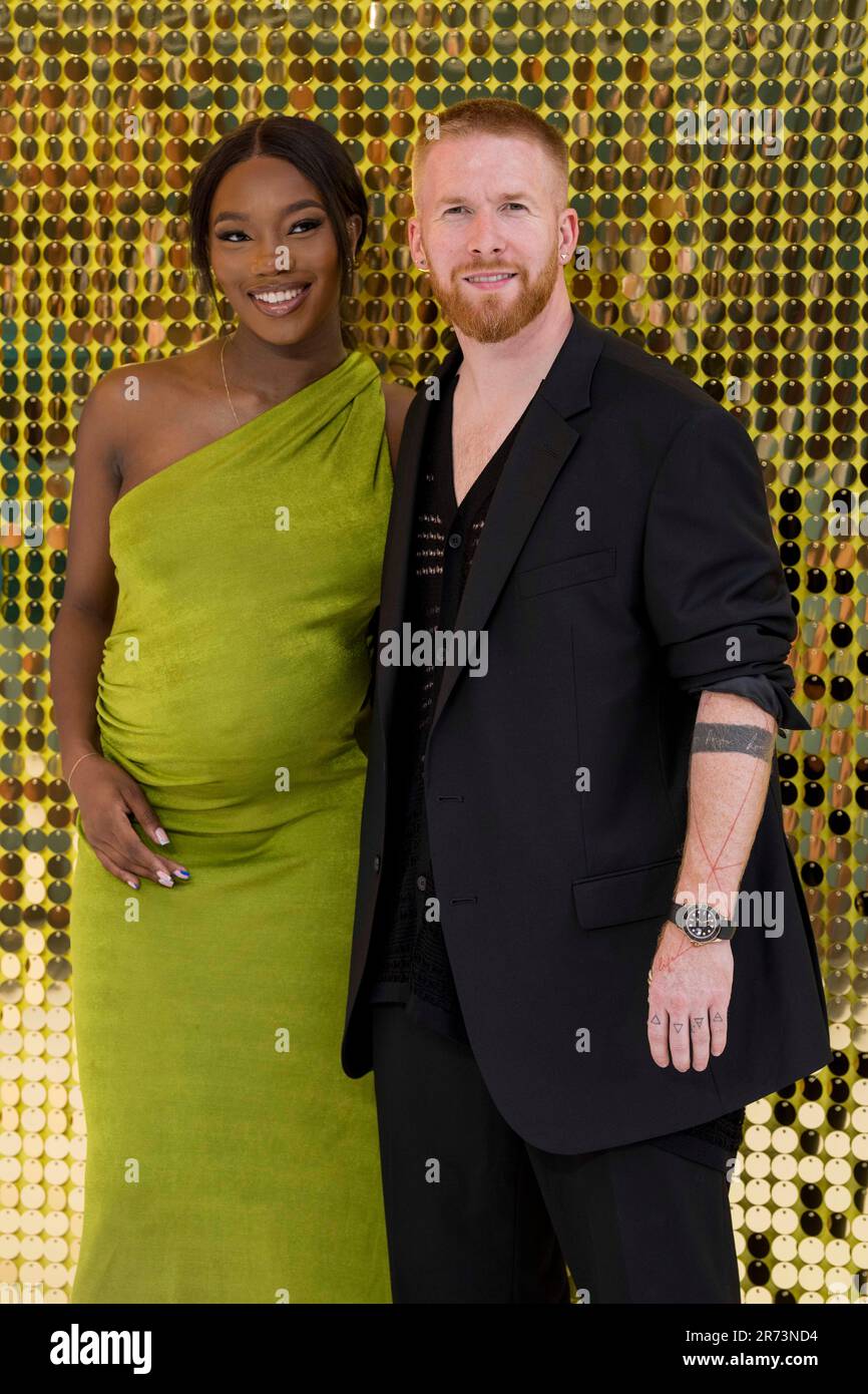 Chyna Mills, left, and Neil Jones pose for photographers upon arrival ...