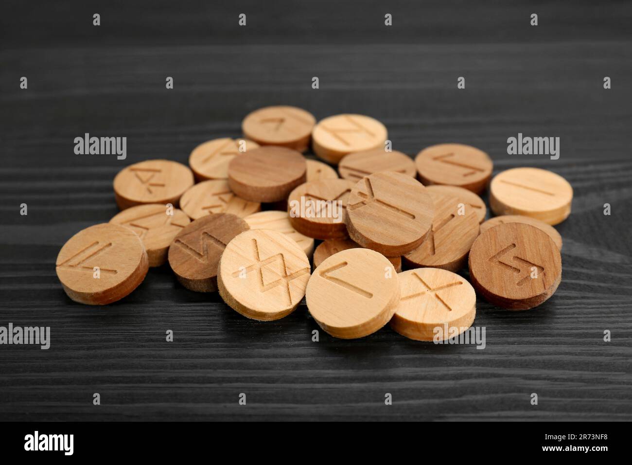 Wooden runes on table hi-res stock photography and images - Alamy