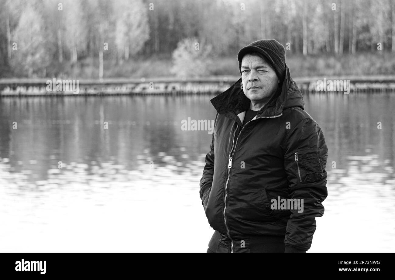 Man standing at lake Black and White Stock Photos & Images - Alamy