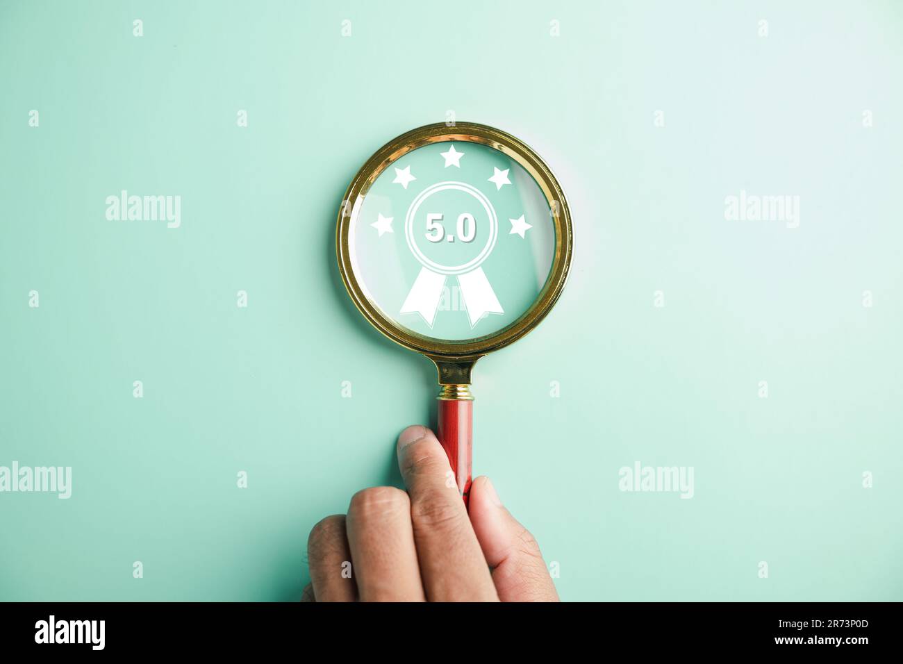 Magnifier in hand focuses on selected happy smiley face icon Stock ...
