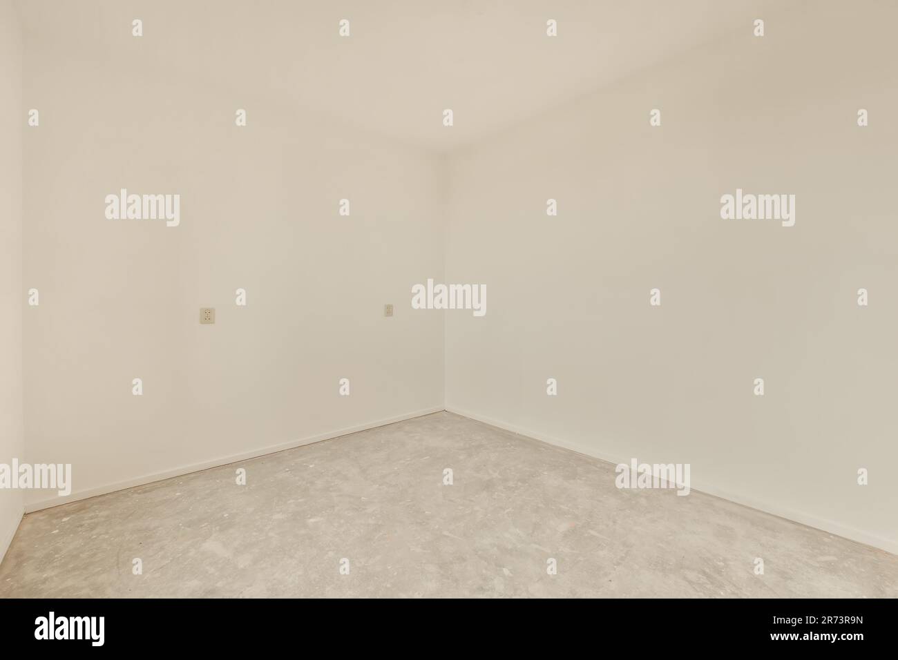 an empty room with white walls and no one wall in the room is visible ...