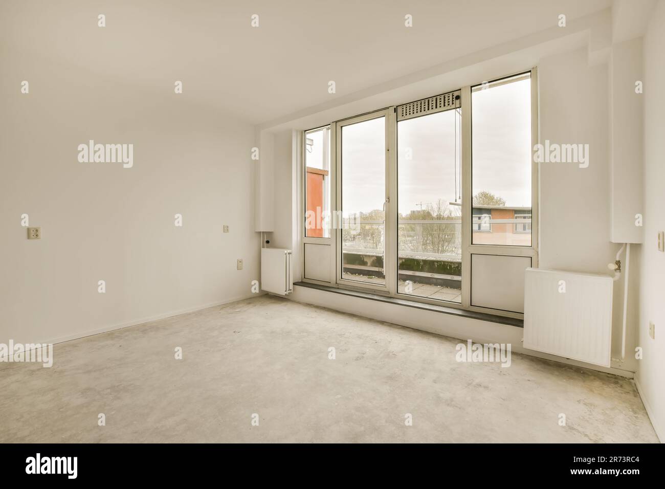 an empty room with large windows and no one person in the room to see ...
